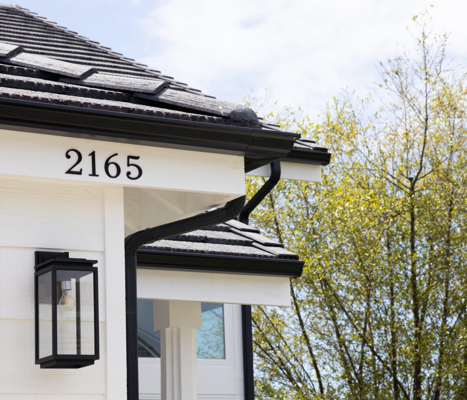 Elevating Curb Appeal: Black Seamless Rain Gutters
